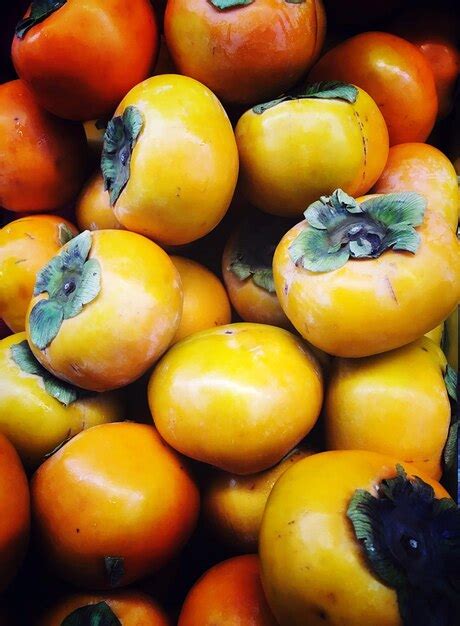 Premium Photo Full Frame Shot Of Persimmons In Market
