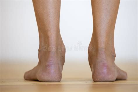 Woman Bare Feet On The Floor Legs Care And Skin Treatment Concept