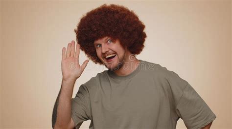 Bearded Man Smiling Friendly At Camera And Waving Hands Gesturing Hello