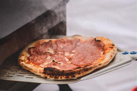 Cooking Or Baking Hot Pizza With Tomato Sauce Mozzarella And Salami