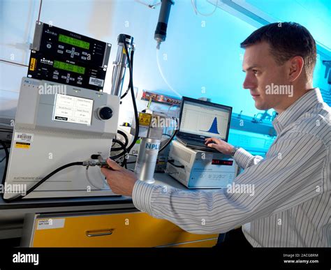 Airborne Nanoparticle Metrology Scientist Using Specialist Equipment To Measure The
