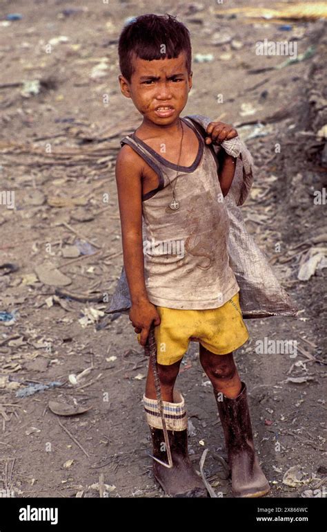 Philippines Manila Boy Collects Useful Things At The Garbage Dump