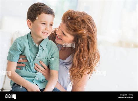 Mother Embracing Son 6 7 Stock Photo Alamy