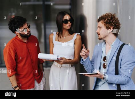 Architects Engineers And Designers Collaborate On A Sustainable Design Project Discussing