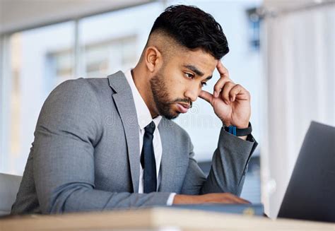 Research Agency Employee Sitting In Office While Using Work Computer To
