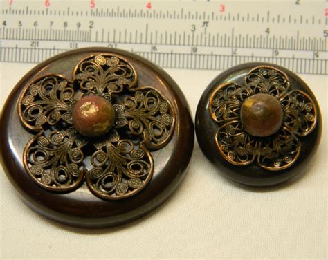 Two Antique Brown Bakelite Buttons With Metal Flowers Etsy
