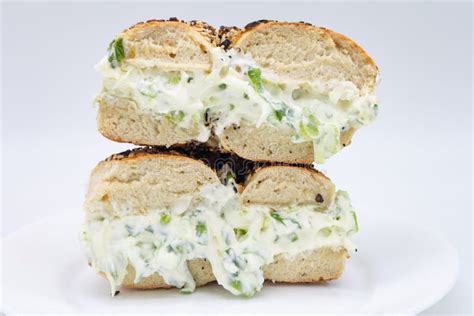 Cut In Half And Stacked New York City Style Toasted Everything Bagel Filled With Scallion Cream