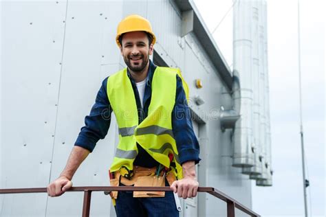 Cheerful Construct Worker In Safety Vest And Helmet Using Digital Tablet Stock Photo Image Of