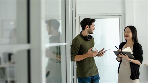 Two People Standing Talking