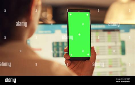 Female Manager Using Smartphone With Greenscreen Display Analyzing Isolated Chroma Key Template
