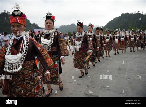 Chinese Girls Of Miao Ethnic Group Wearing Traditional Costumes And