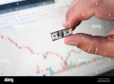 Man Holding Small Dollar In Hands Economical Crisis In The Usa