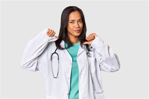 Premium Photo Young Filipina Doctor With Stethoscope In Studio Feels