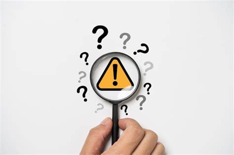 Premium Photo Hand Holding Magnifier Glass With Yellow Triangle