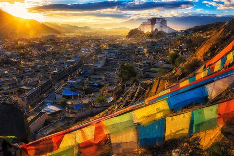 Potala Palace In Lhasa Tibet At Sunset With Prayer Flags Hd Wallpaper