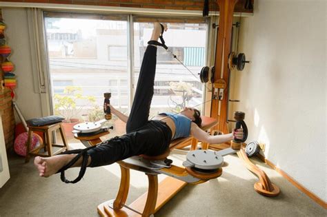 Premium Photo Side View Of Woman Lying On Her Back Training Her