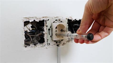 Testing An Electrical Outlet With A Screwdriver Phase Tester Stock Video Video Of Screwdriver