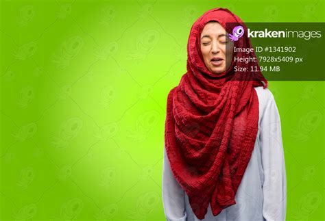 Young Arab Woman Wearing Hijab Crying Depressed Full Of Sadness