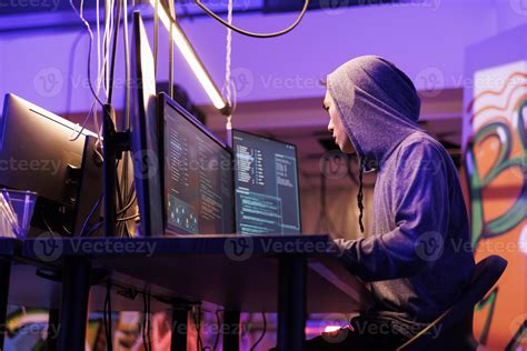 Internet Criminal In Hood Planning Online Scam While Coding Malicious