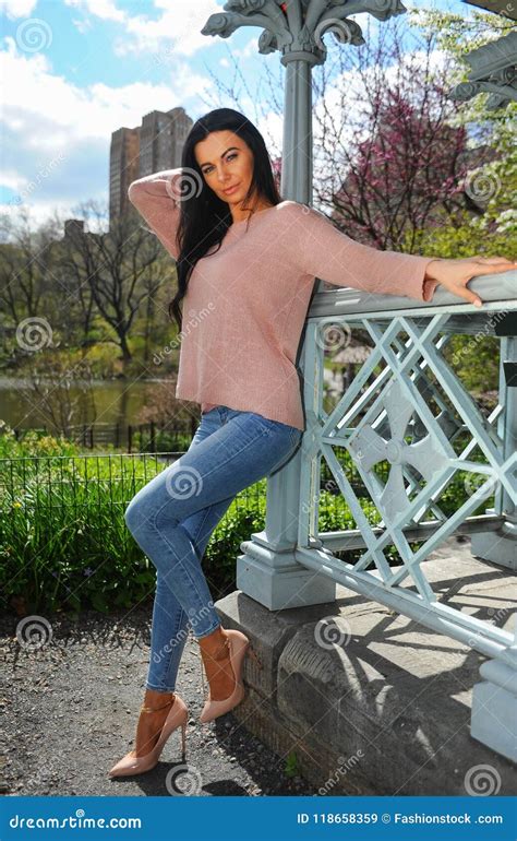 Attractive Brunette Model Posing Pretty In The Park Stock Image