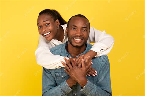 Premium Photo Cheerful African American Couple Embracing Posing Over