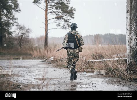 Soldier Or Militiaman In Camouflage With Assault Rifle Fighting In
