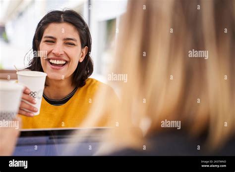 Mid Shot Front View Of Latin American Businesswoman Laughing With Her