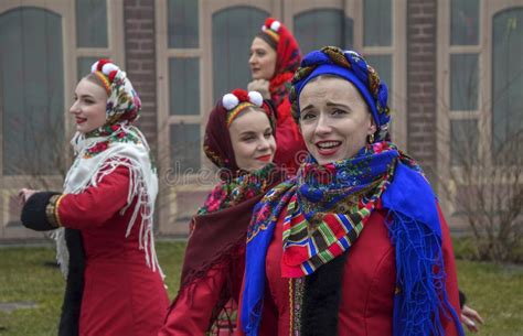 Group Of Singers Dressed In Vibrant Traditional Folk Costumes
