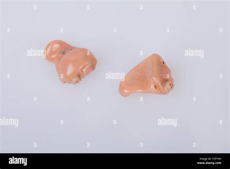 Small Modern Hearing Aids On White Background Isolated Alternative To