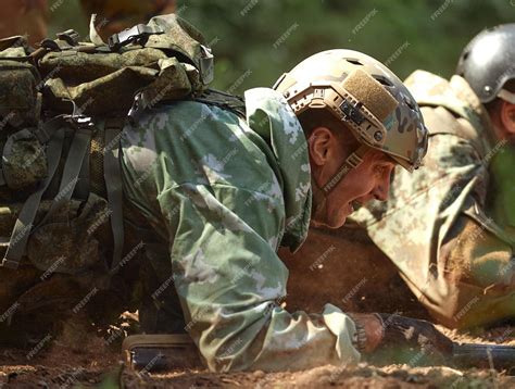 Premium Photo Soldiers Game On Military Training Ground Battle Camp