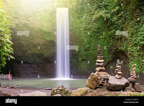 Long Exposure Tibumana Waterfall And Stack Of Rock Bangli Bali