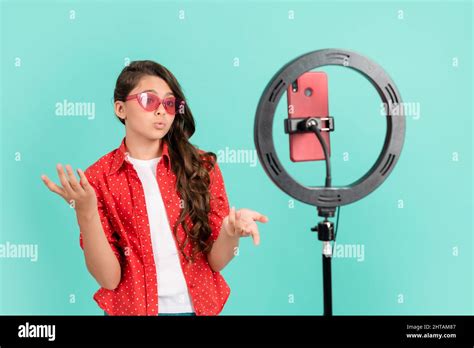 Serious Teen Girl Talking On Camera Video Blog Blogging Online With