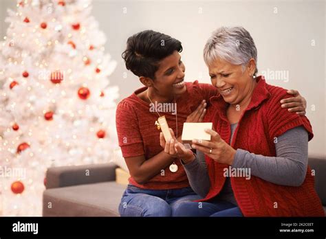 Experiencing The Joys Of Giving And Receiving A Senior Woman Receiving