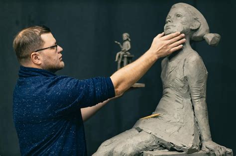 Premium Photo Man Sculptor Creates Sculpt Bust Clay Human Woman