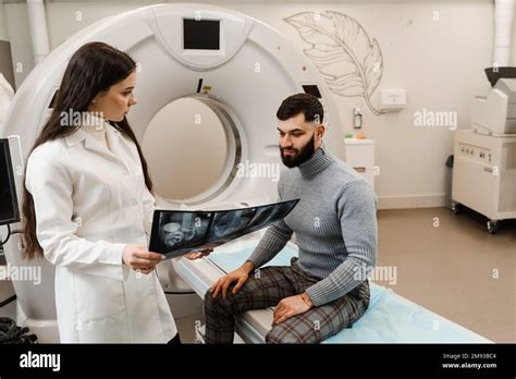 Ct Doctor Consulting Patient And Showing Chest X Ray To Patient In