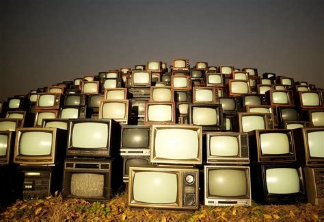 A Hill Covered In Multiple Old Fashioned Tvs Hackernoon