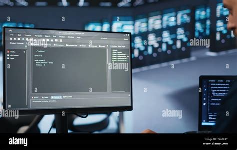 System Administrator Running Script On Computer Screen In High Tech