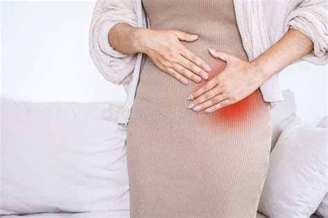 Woman Suffering From Lower Abdominal Left Side Pain Stomachache Stock