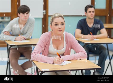 Three Babes In A Classroom About To Take Notes Stock Photo Alamy