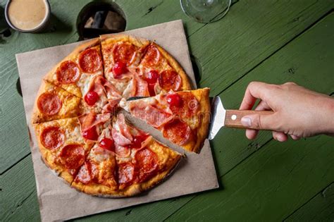 Tasty Pepperoni Pizza And Cooking Ingredients Tomatoes Basil On Black