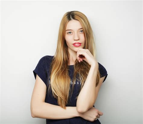 Premium Photo Young Cute Smiling Blond Girl Over White Background