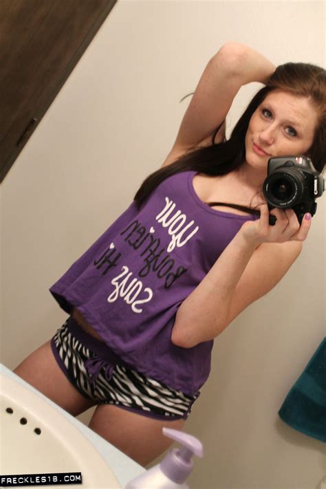 Amateur Chick Freckles 18 Sticks Out Her Tongue While Taking Mirror