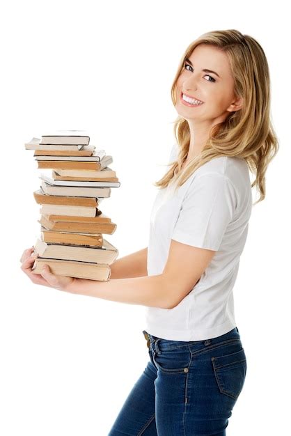 Premium Photo Smiling Young Woman Holding Books Against White Background