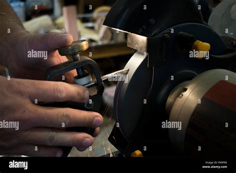 Man Sharpening Chisel Stock Photo Alamy