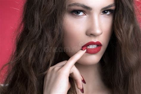 Sensual Beautiful Woman Posing In Red Dress Girl With Long Curly Hair