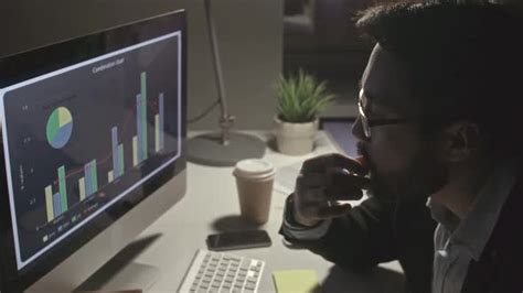 Office Worker Analyzing Charts Stock Footage Videohive