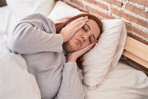 Young Beautiful Plus Size Woman Stressed Lying On Bed At Bedroom Stock