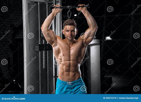Young Handsome Guy Doing Exercises In The Gym Stock Image Image Of