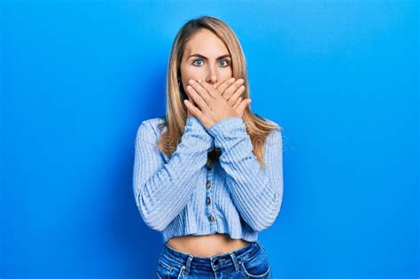 Young Caucasian Woman Wearing Casual Clothes Shocked Covering Mouth