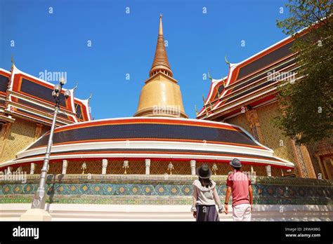 Couple Impressed By A 43 Meters High Gilded Pagoda And The Iconic